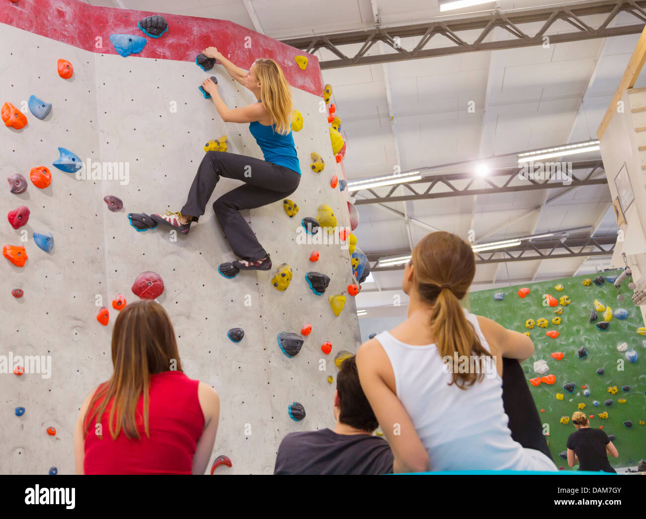 Friends relaxing together, indoor climbing Stock Photo - Alamy