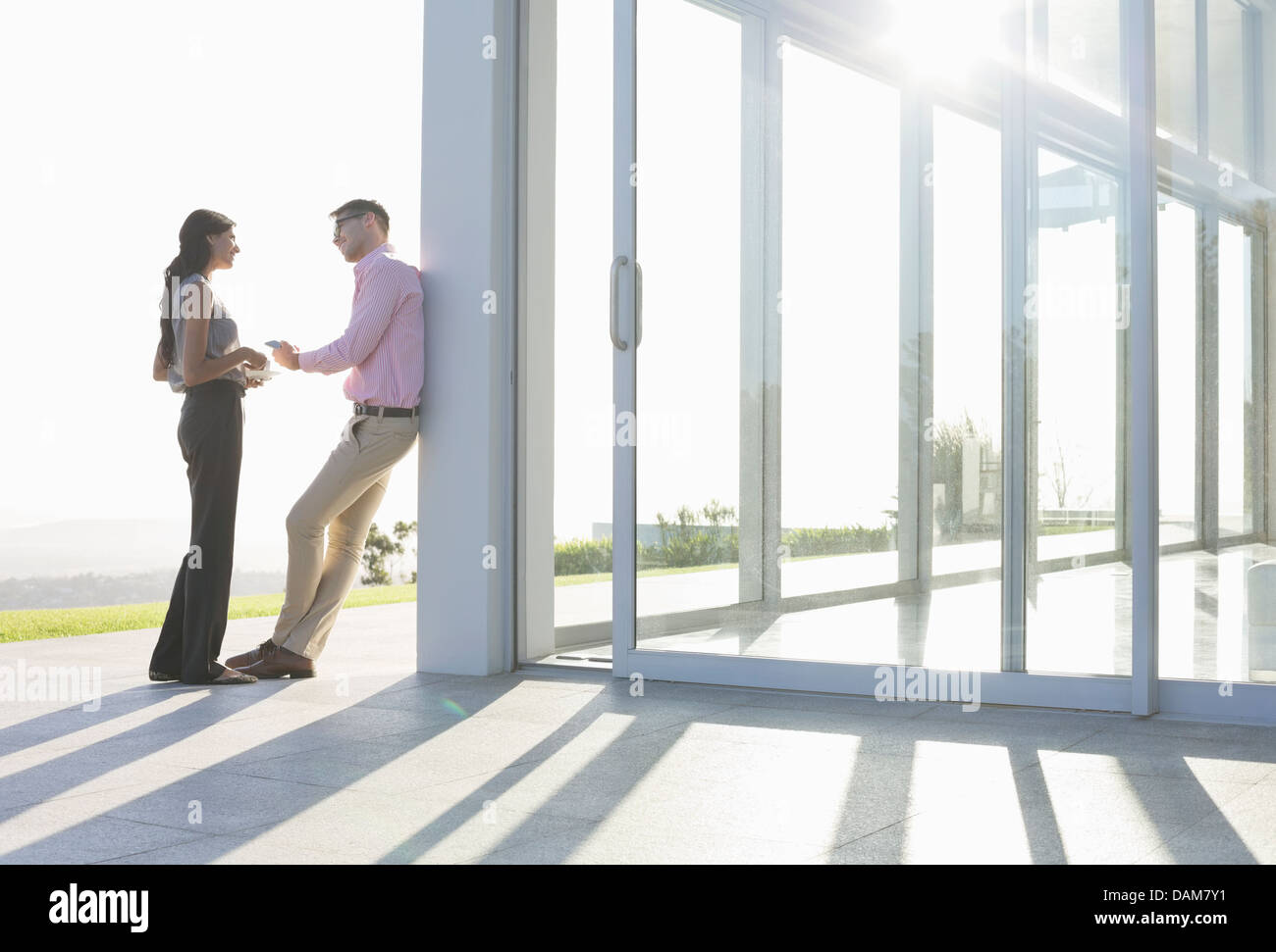 Business people talking outside office Stock Photo - Alamy
