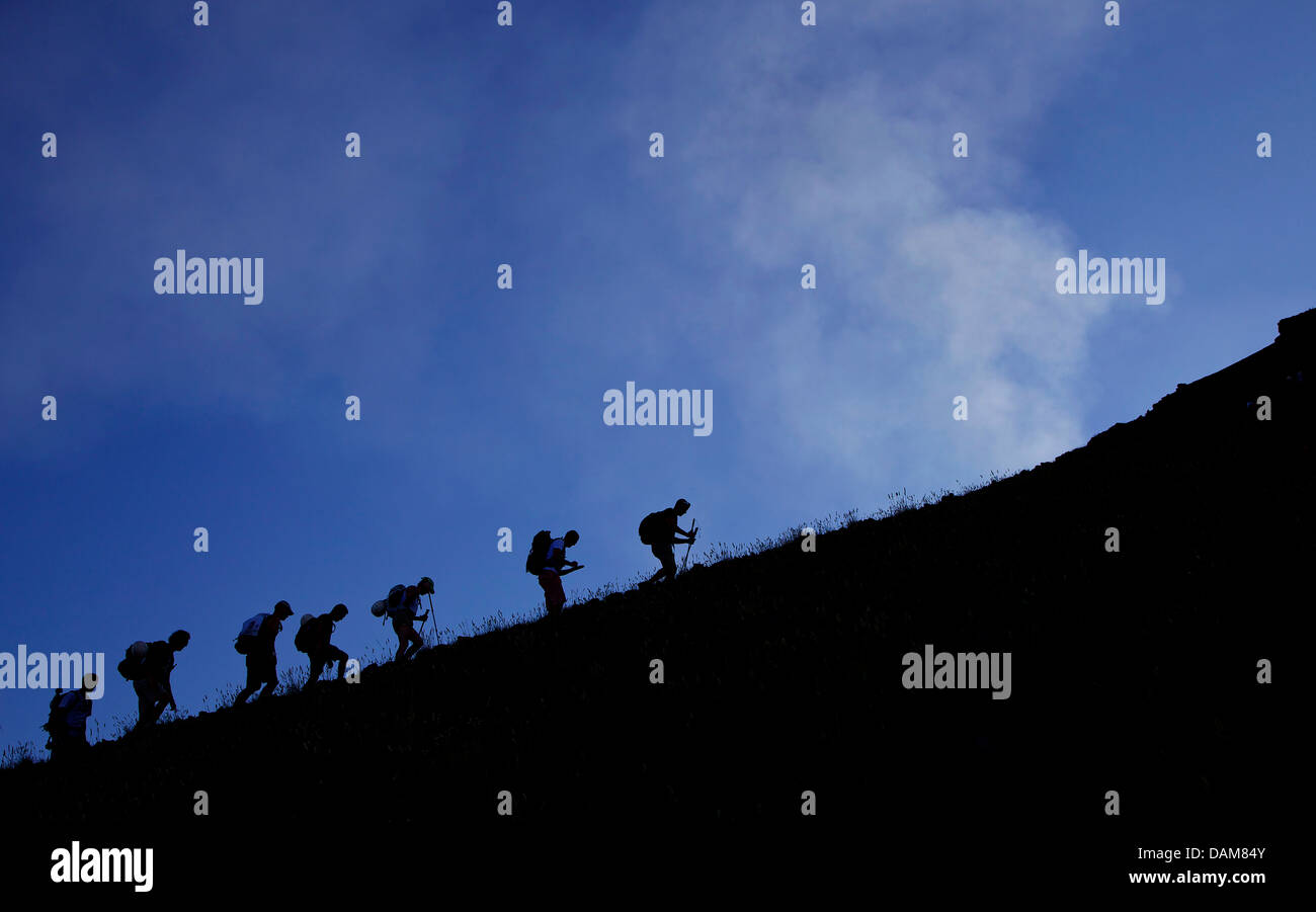 People climbing, hikers in trekking activity on Stromboli, active ...