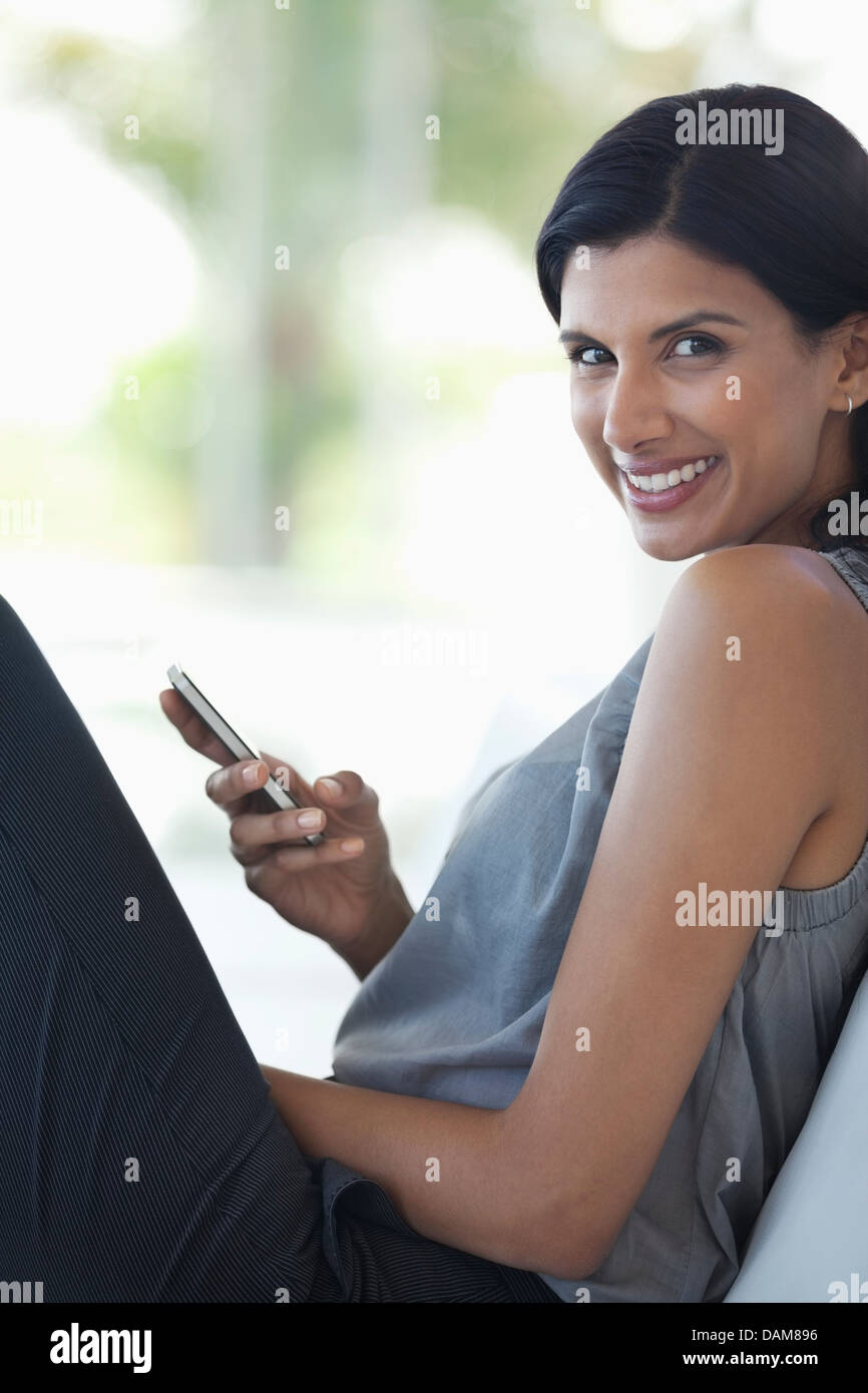 Businesswoman using cell phone Stock Photo - Alamy