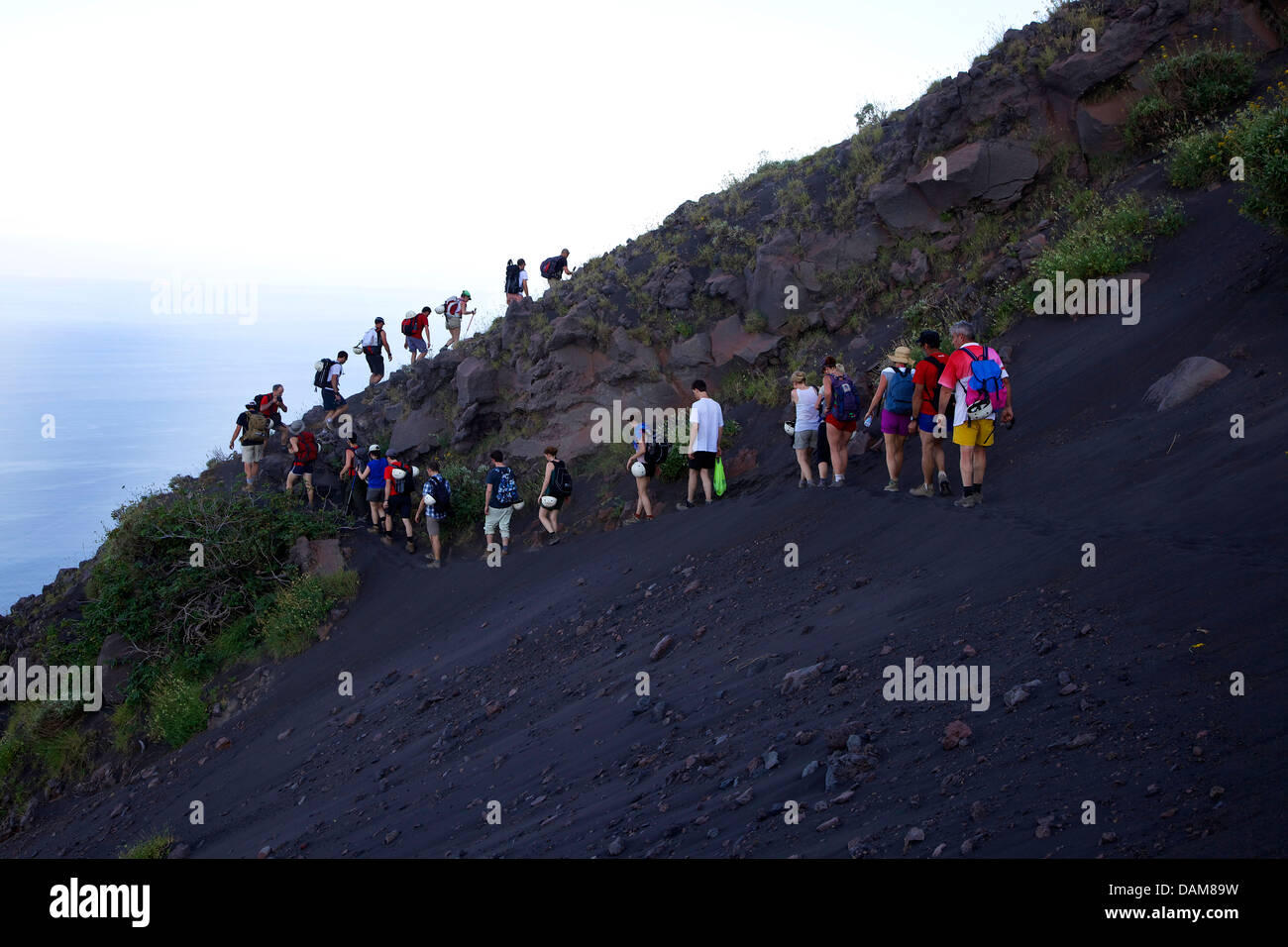 People climbing Stromboli, active volcano in the Aeolian islands ...