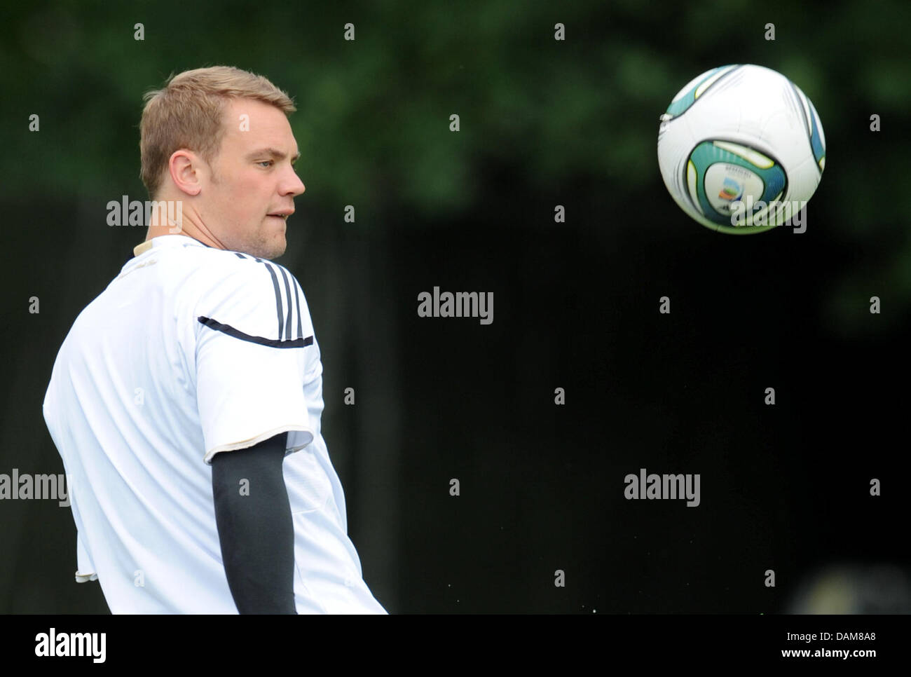 German national soccer team head goalkeeper, Manual Neuer, fixes his ...