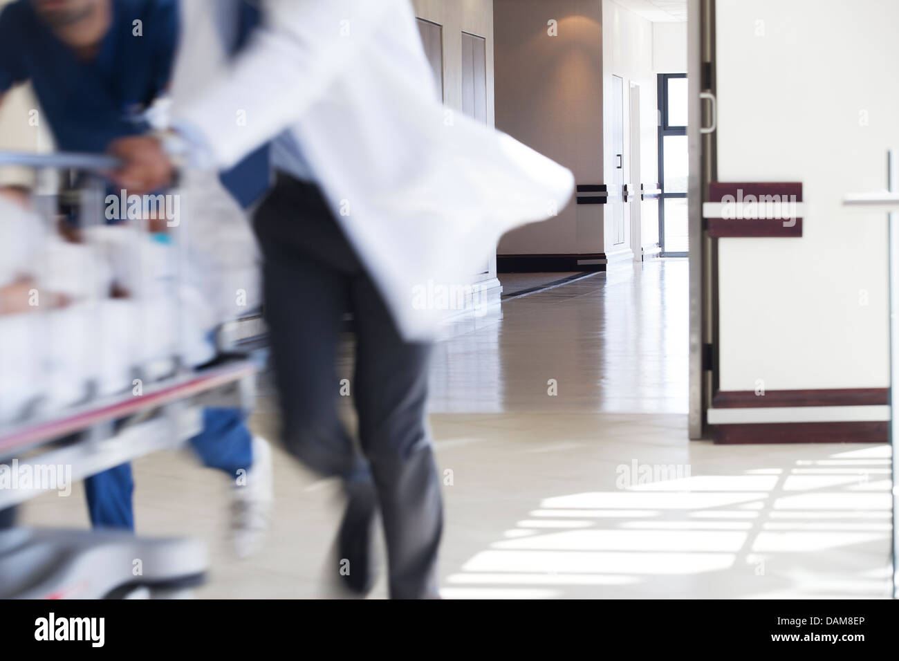 Hospital staff rushing patient to operating room Stock Photo - Alamy