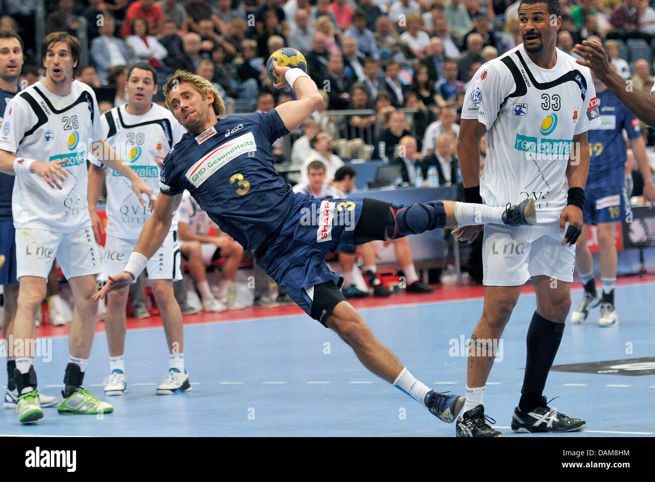 Hamburg's Stefan Schroeder throws the ball in the Handball Champions ...