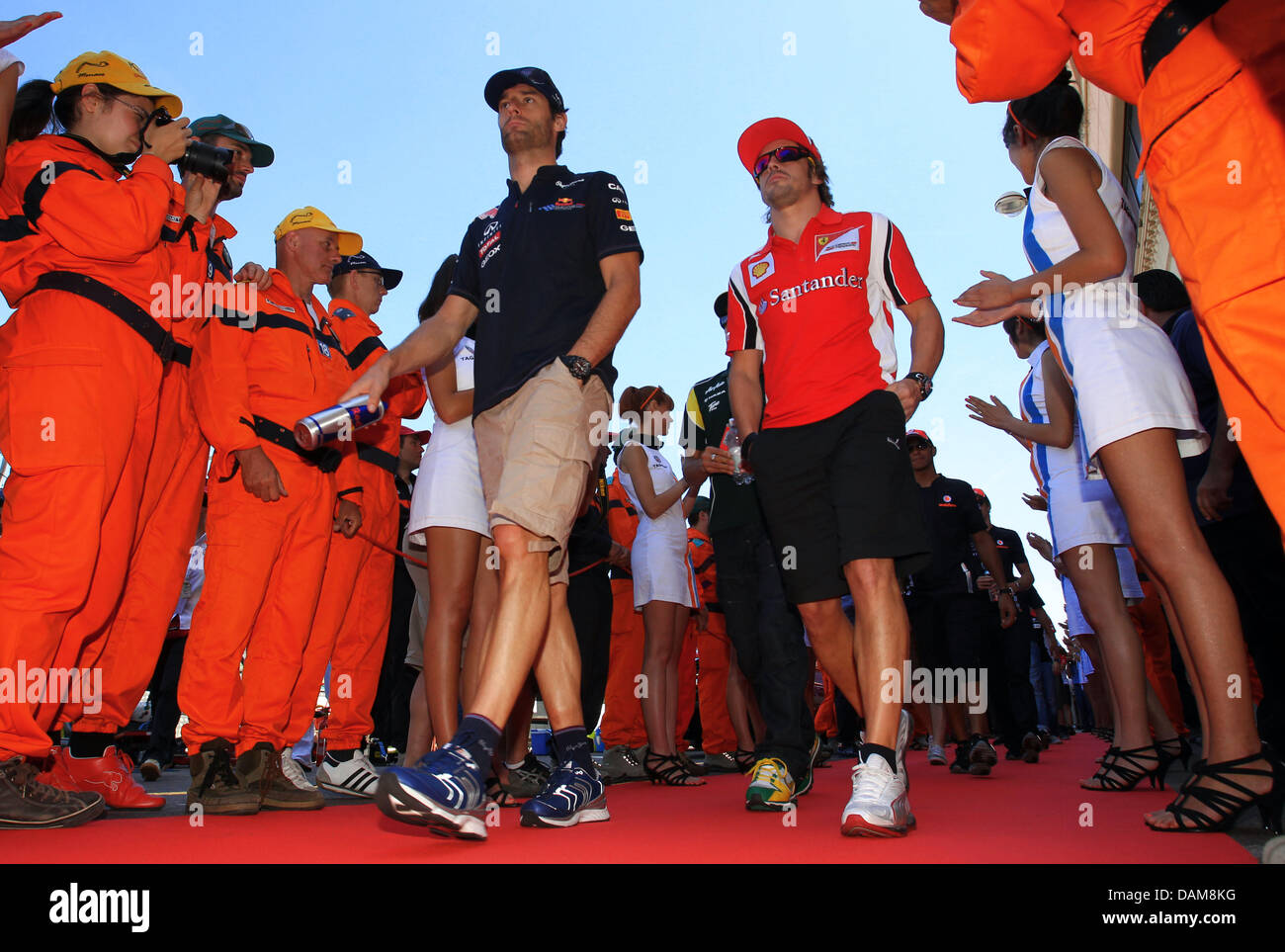 Australian Formula One driver Mark Webber (L) of Red Bull Racing and ...