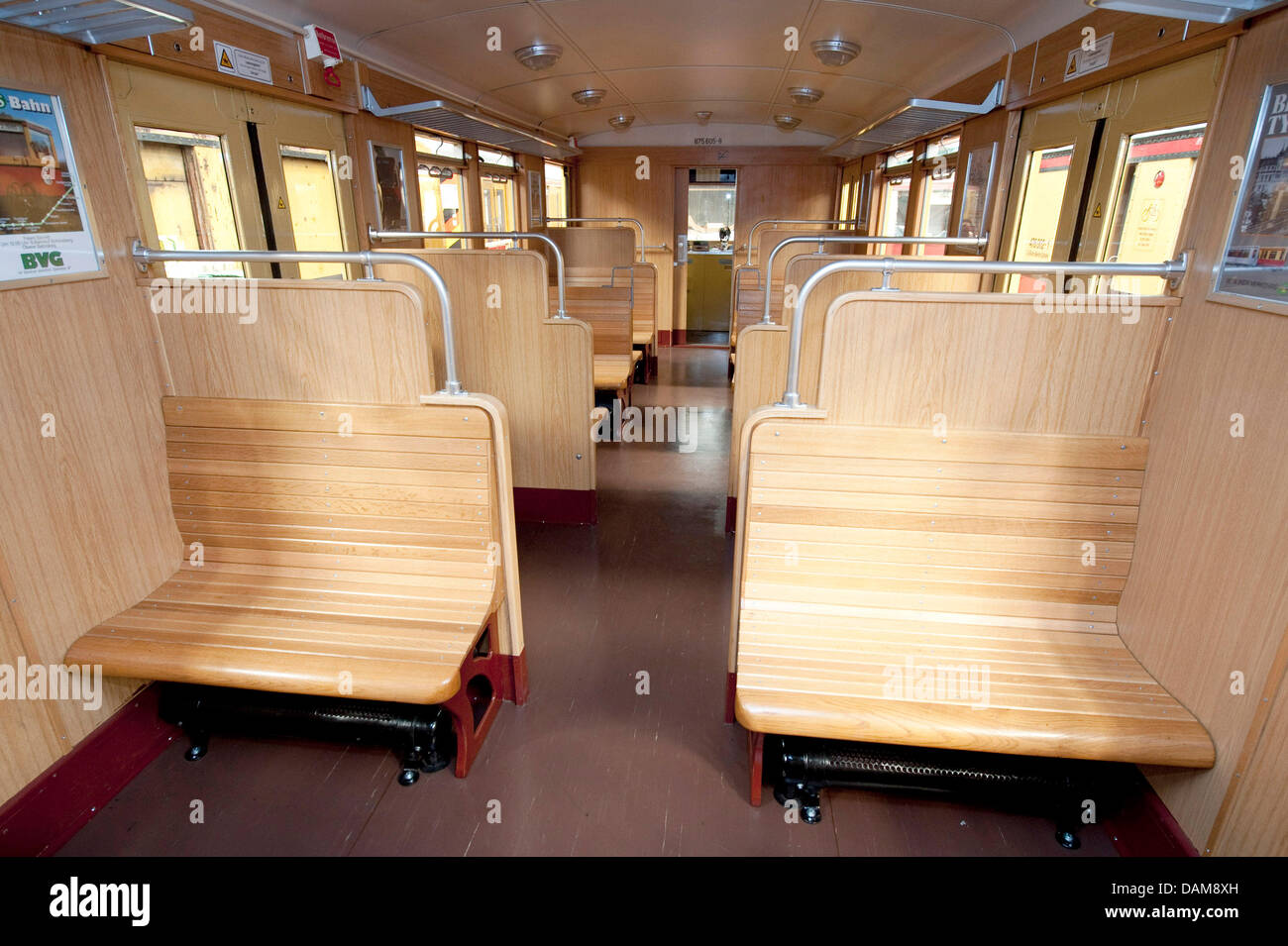 Wooden seats are installed in a historical S-Bahn train inside a garage ...