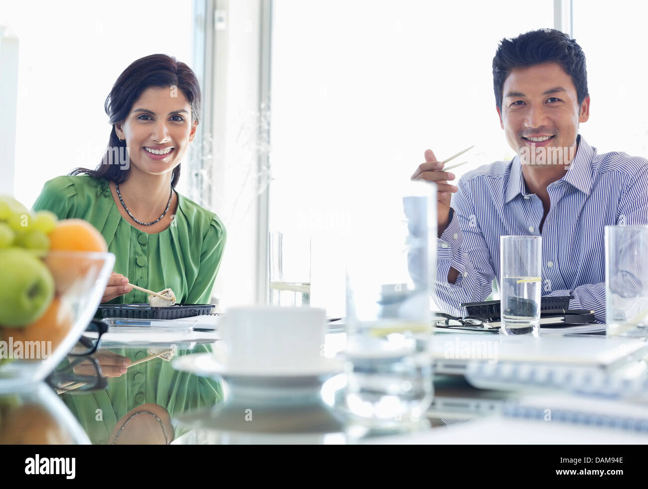 Business people smiling in meeting Stock Photo - Alamy