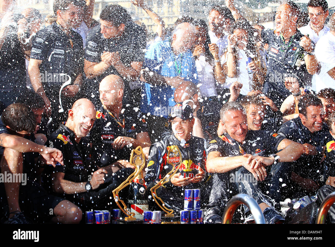 German Formula One driver Sebastian Vettel (C) of Red Bull celebrates ...