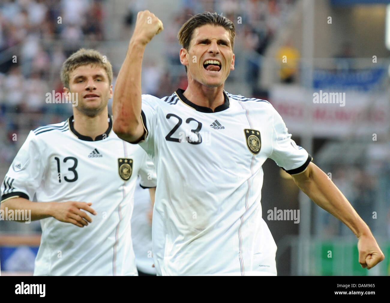 Germany's Mario Gomez (R) and Thomas Mueller celebrate Gomez's 1-0 ...