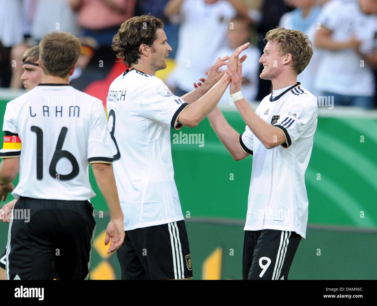 Germany's Philipp Lahm (L-R), Arne Friedrich and Andre Schuerrle ...