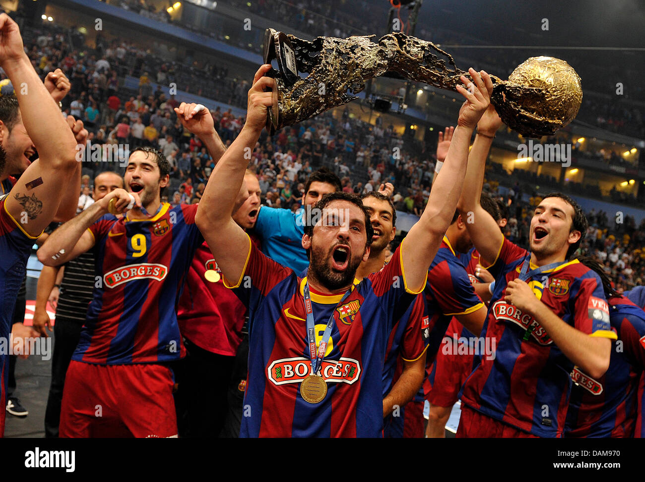 Barcelona's players celebrate winning the handball Champions League ...