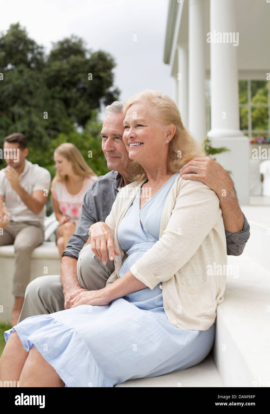 Affectionate young couple sitting on hi-res stock photography and ...