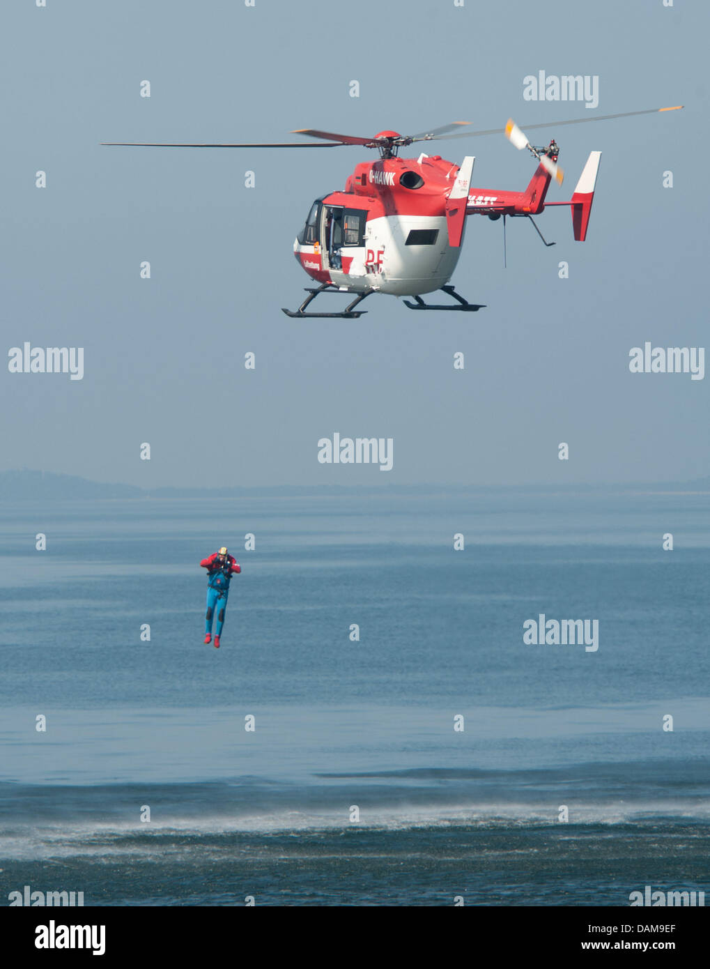 A DRF Luftrettung (air rescue) helicopter hovers over the Baltic near ...