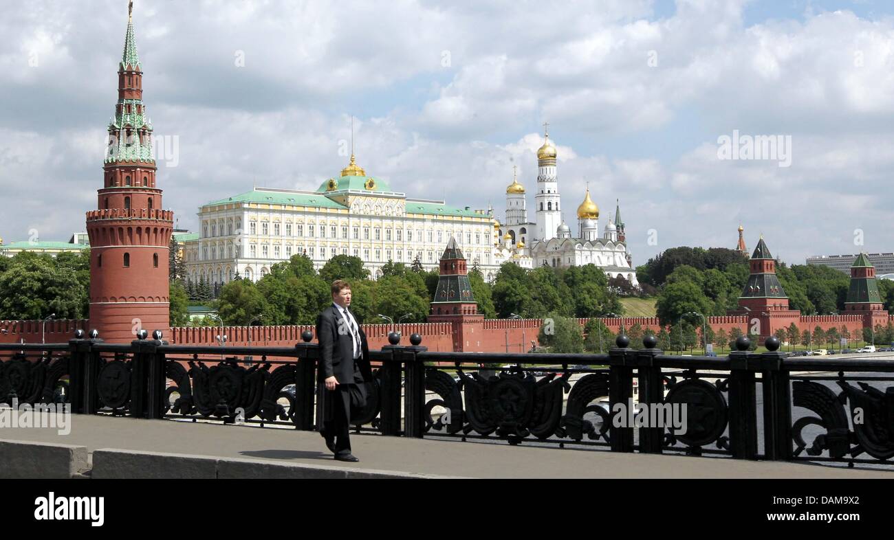 A man walks by the Kremlin in Moscow, Russia, 31 May 2011. Photo ...