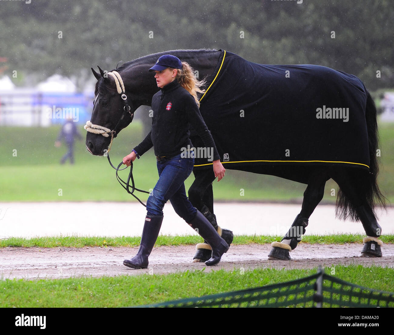 A groom takes dressage horse Totilas to the Olympic riding complex in ...