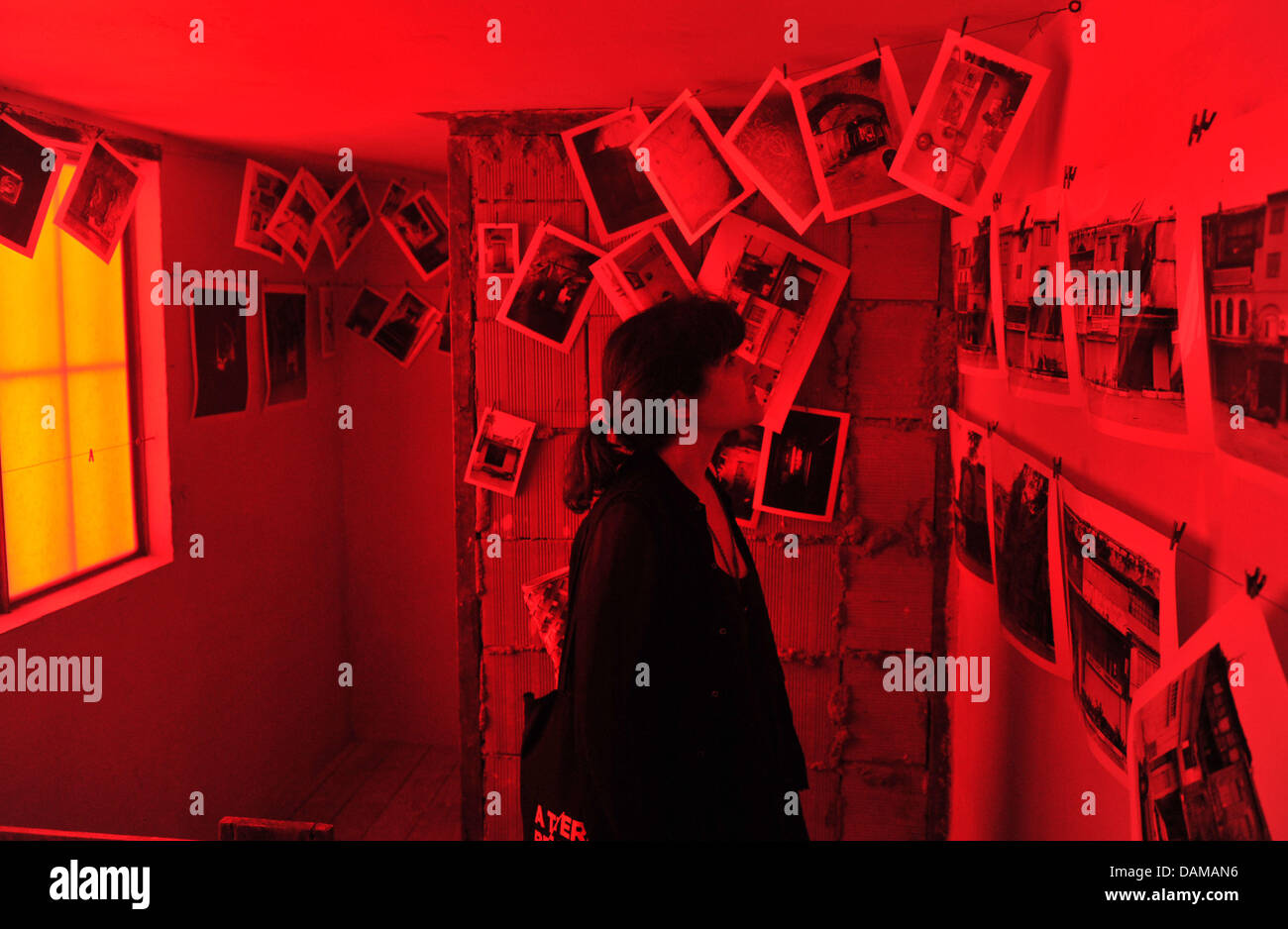 A visitor looks at the installation of artist Mike Nelson at the ...