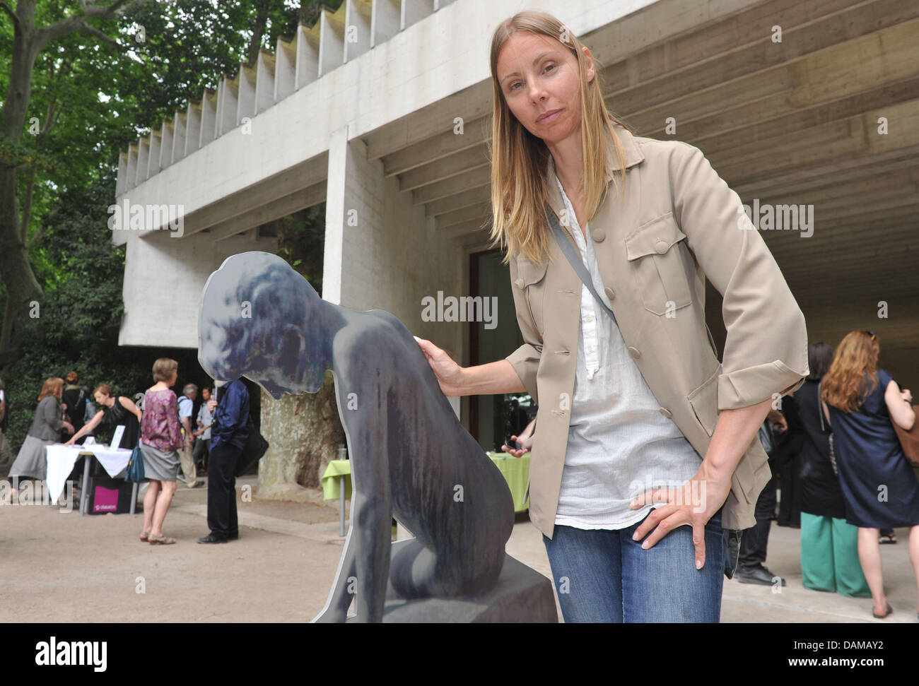 Swedish artist Fia Backstroem poses next to one of her works at the ...