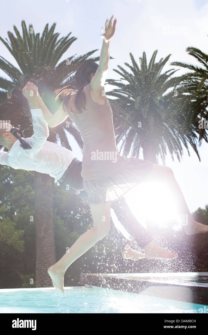 Two men jumping swimming pool hi-res stock photography and images - Alamy