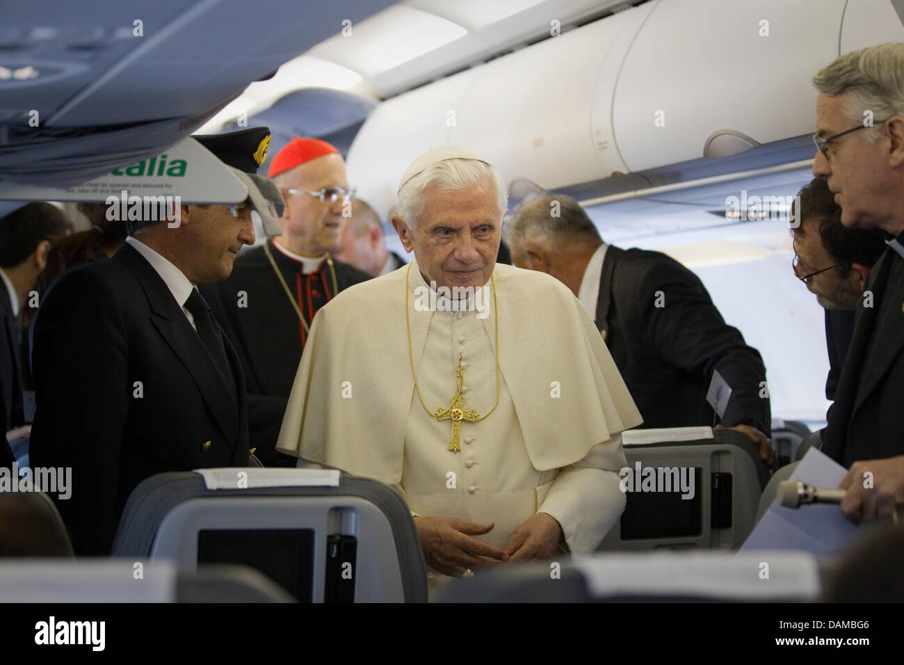 Pope Benedict XVI walks onboard the plane during his flight from Rome ...