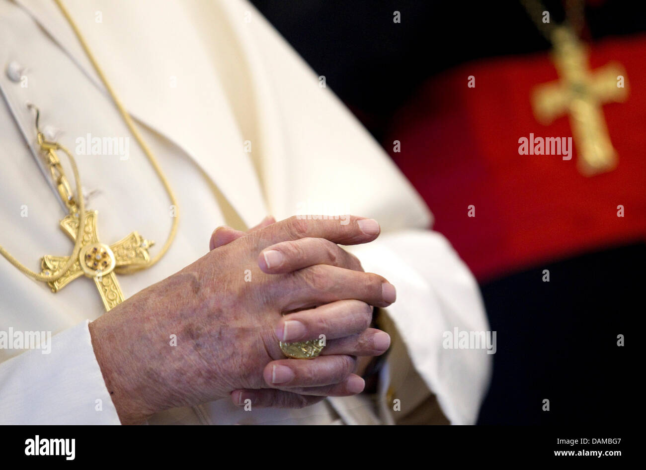Pope Benedict XVI holds his hand folded after his arrival at the ...