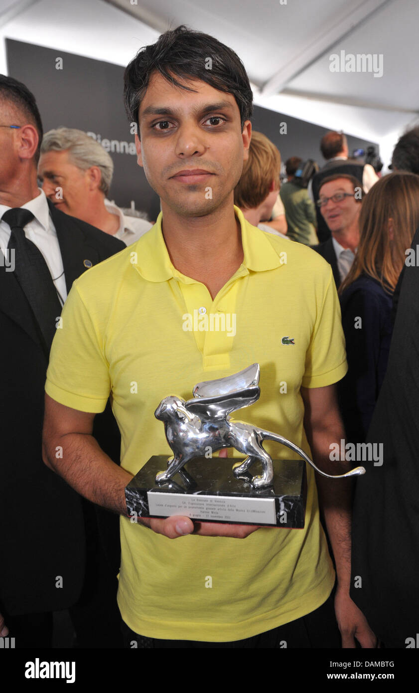 British artist Haroon Mirza poses with his Golden Lion for best up-and ...