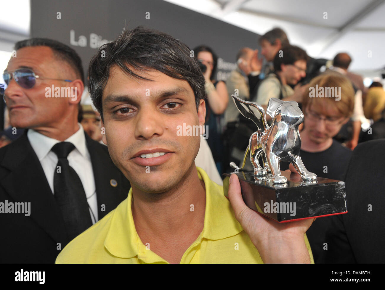 British artist Haroon Mirza poses with his Golden Lion for best up-and ...
