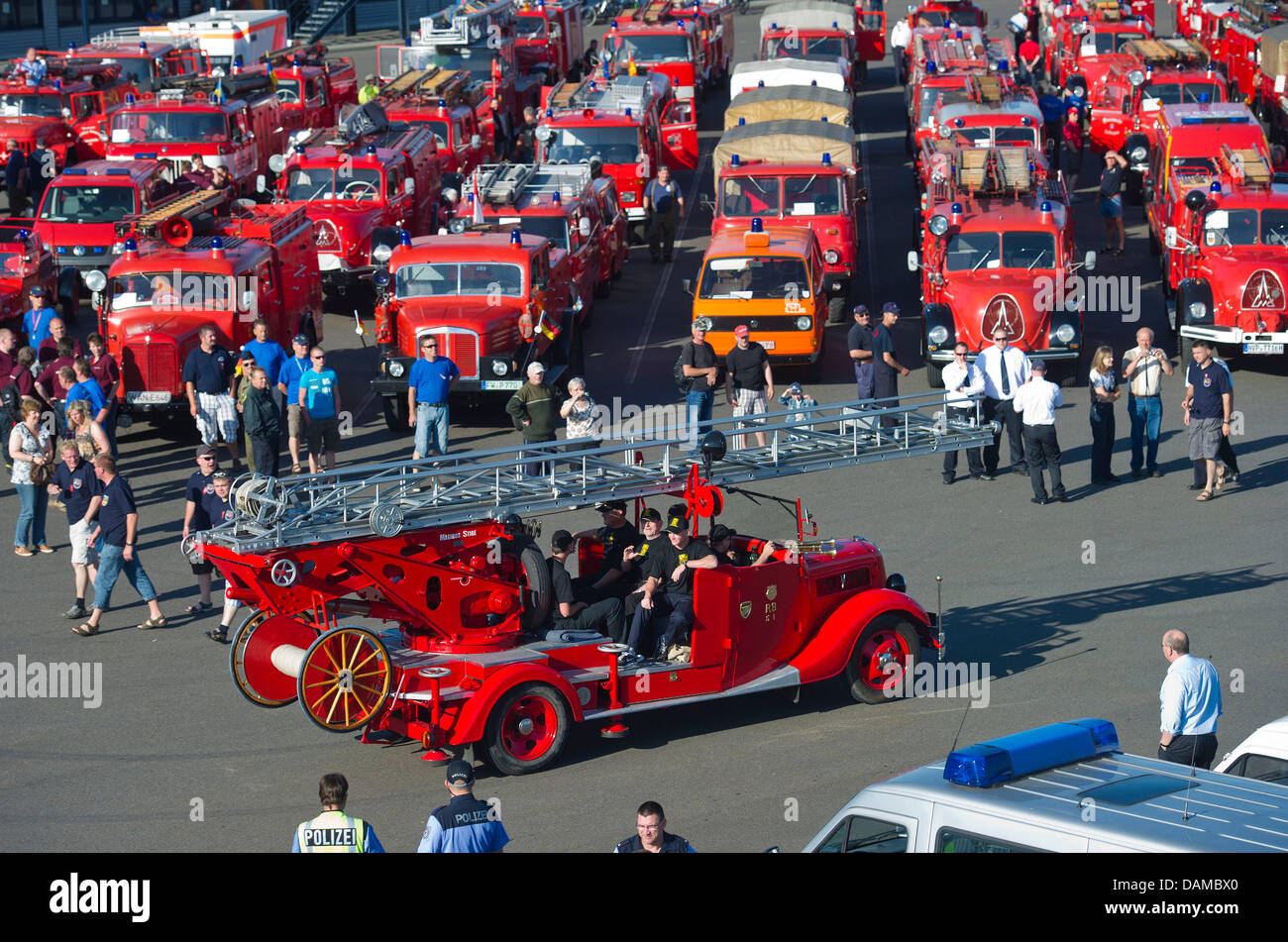 Historic fire engines are on display on a square during the opening of ...