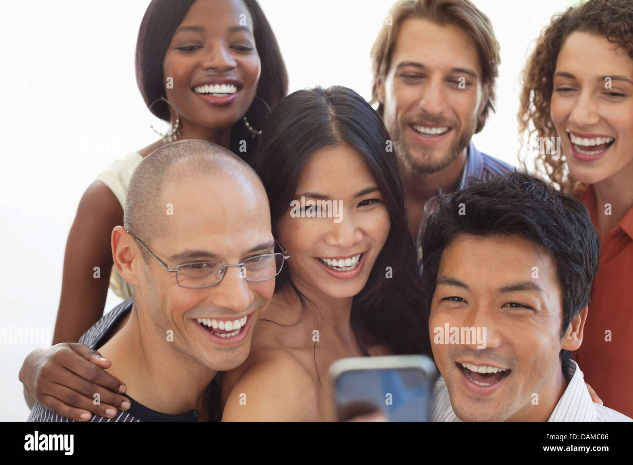 Friends taking picture together Stock Photo - Alamy