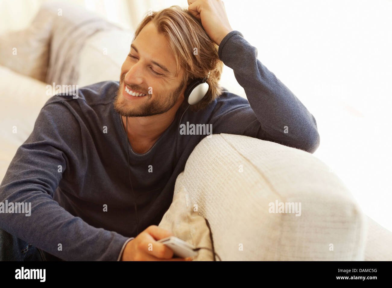 Portrait happy man listening hi-res stock photography and images - Alamy