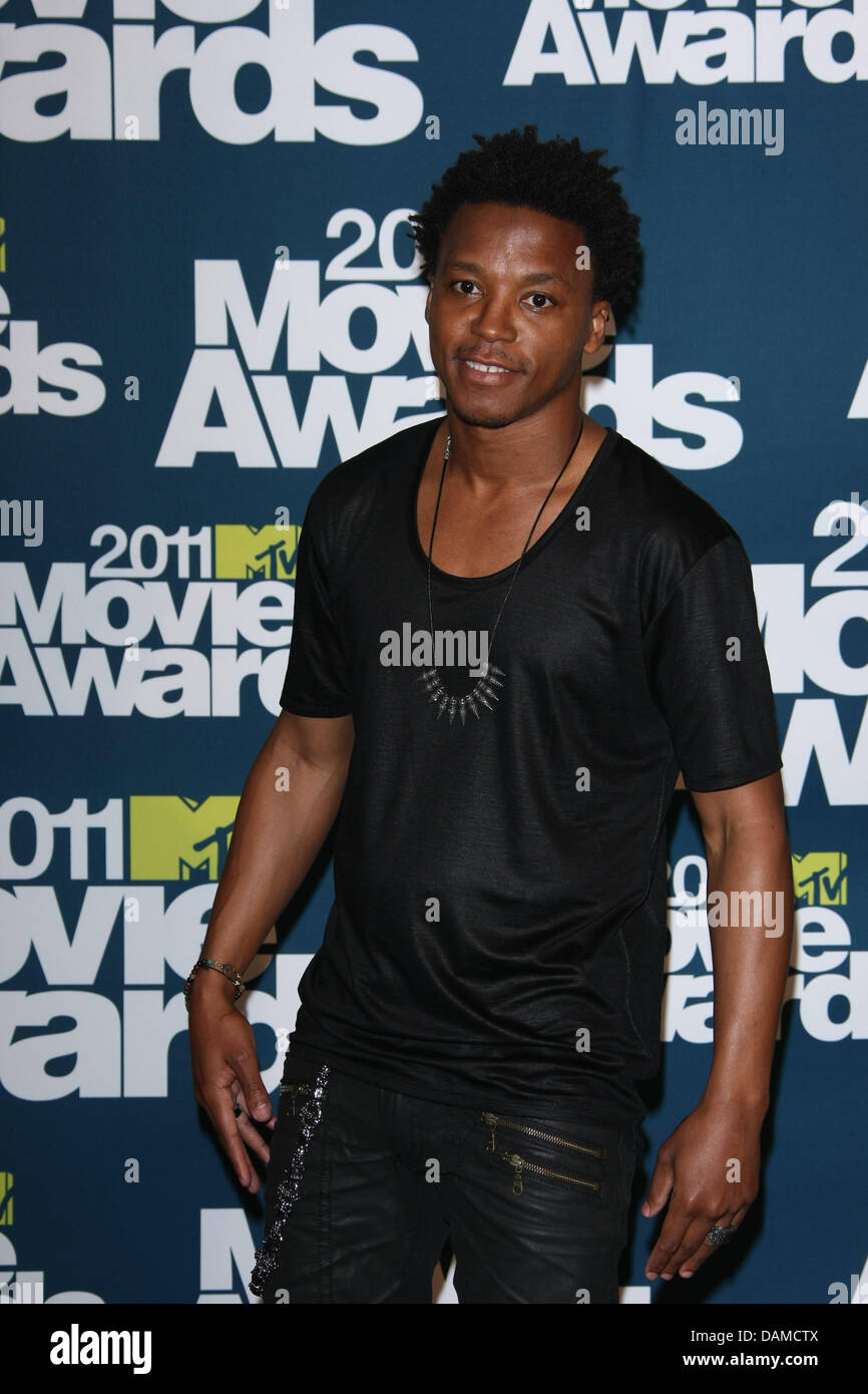 Rapper Lupe Fiasco poses in the photo press room of the MTV Movie ...