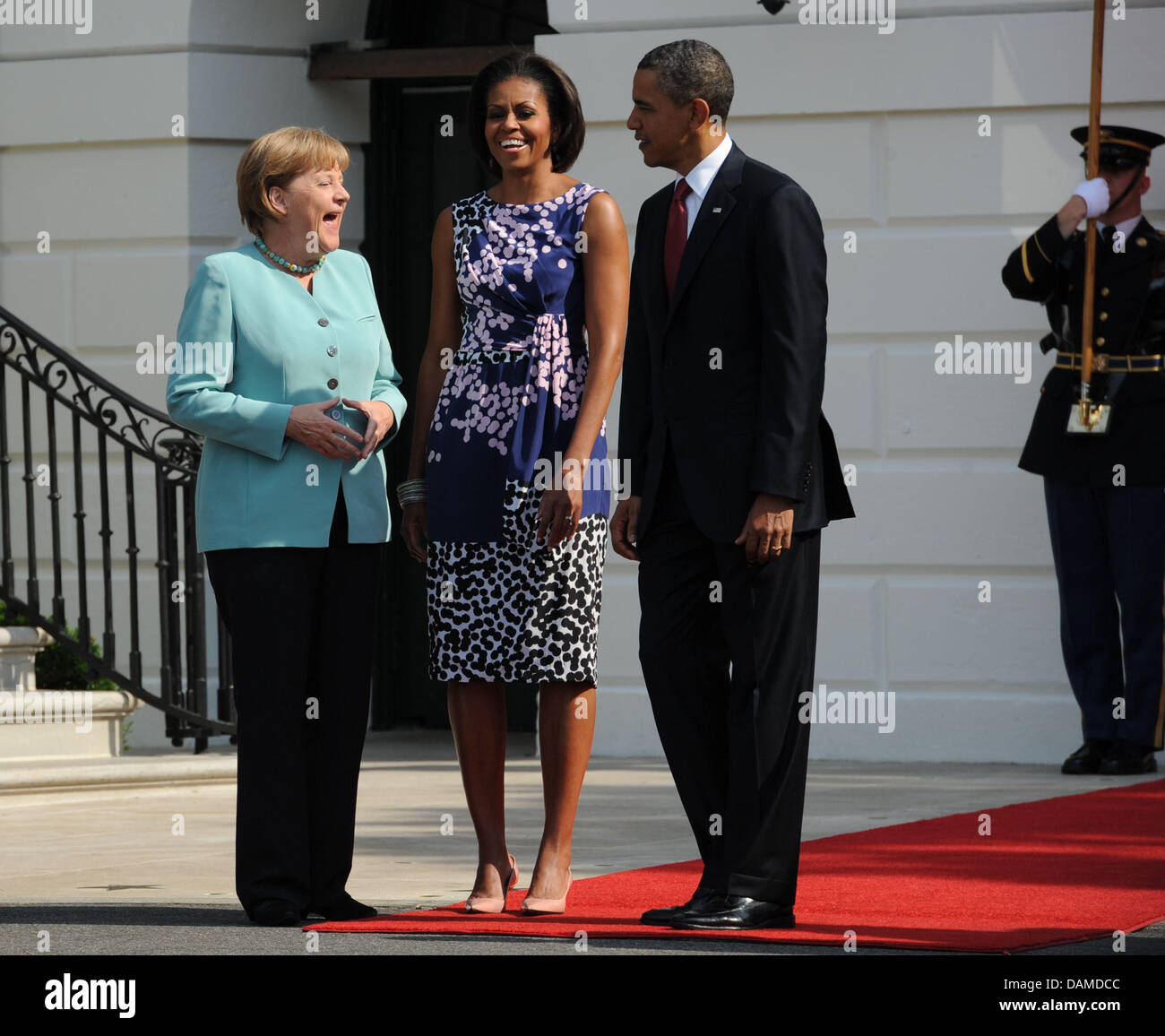 US President Barack Obama (R) and his wife Michelle (M) meet German ...