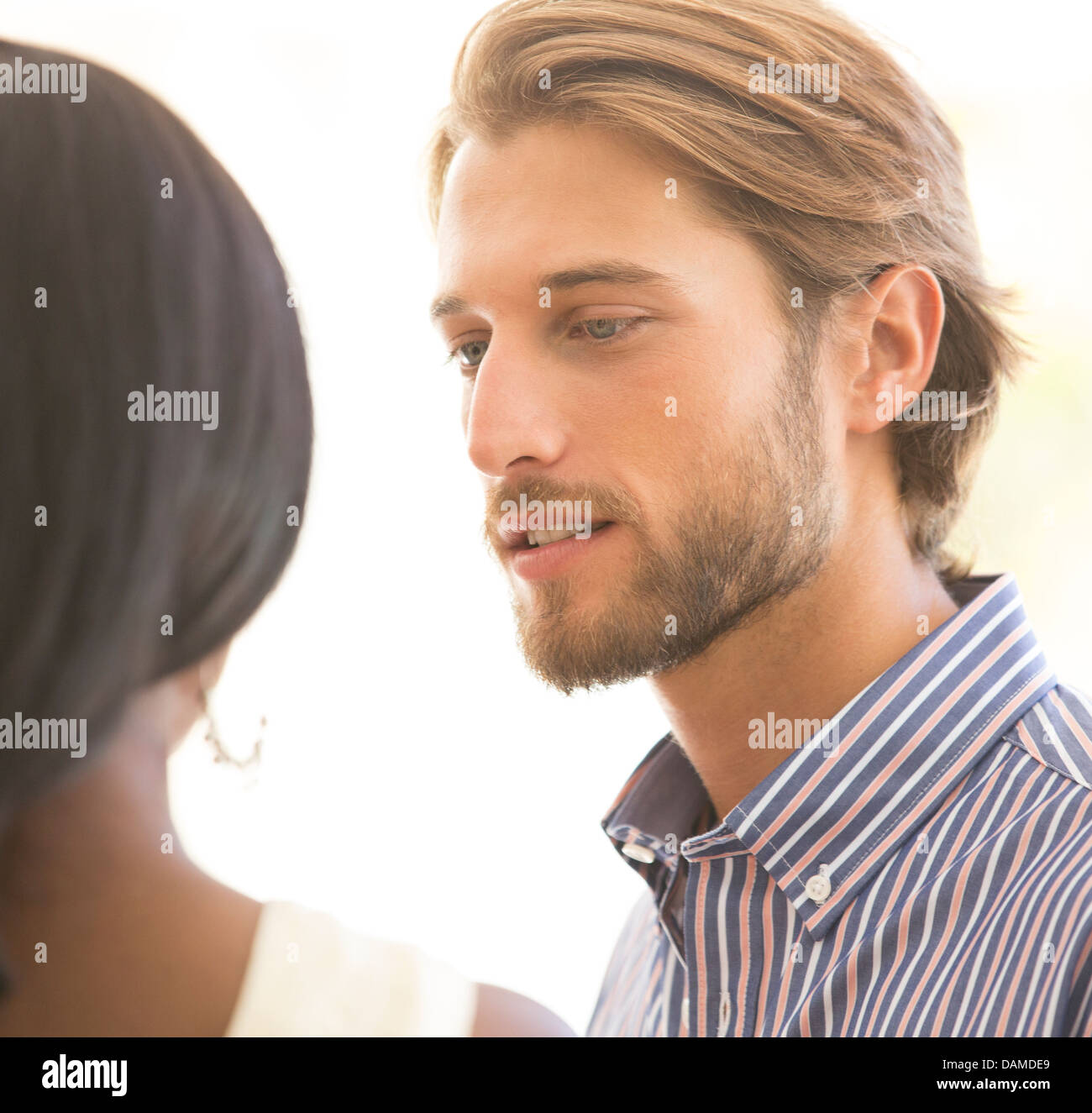 Man talking to girlfriend Stock Photo - Alamy
