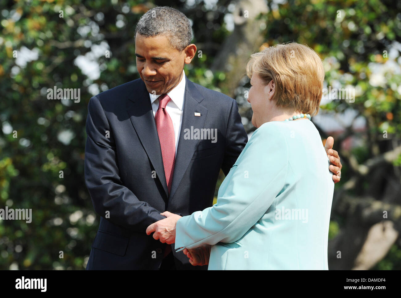 German Chancellor Angela Merkel and US President Barack Obama shae ...