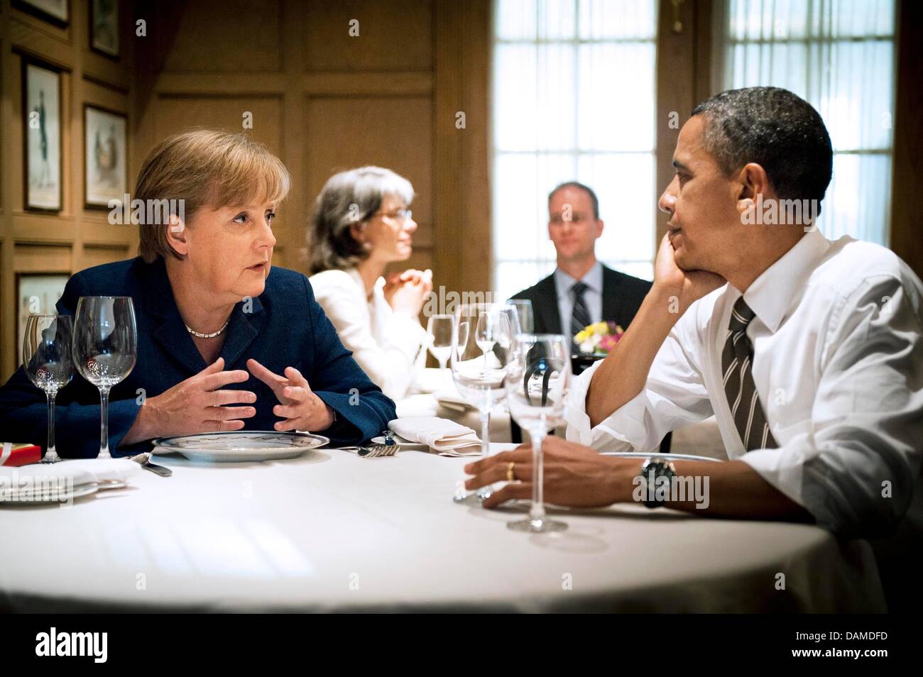 German Chancellor Angela Merkel and US President Barack Obama converse ...