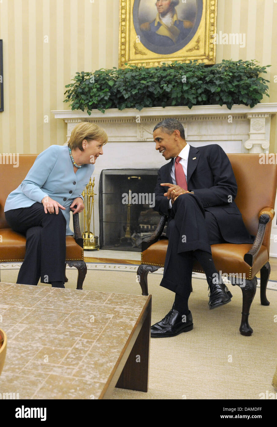German Chancellor Angela Merkel and US President Barack Obama converse ...