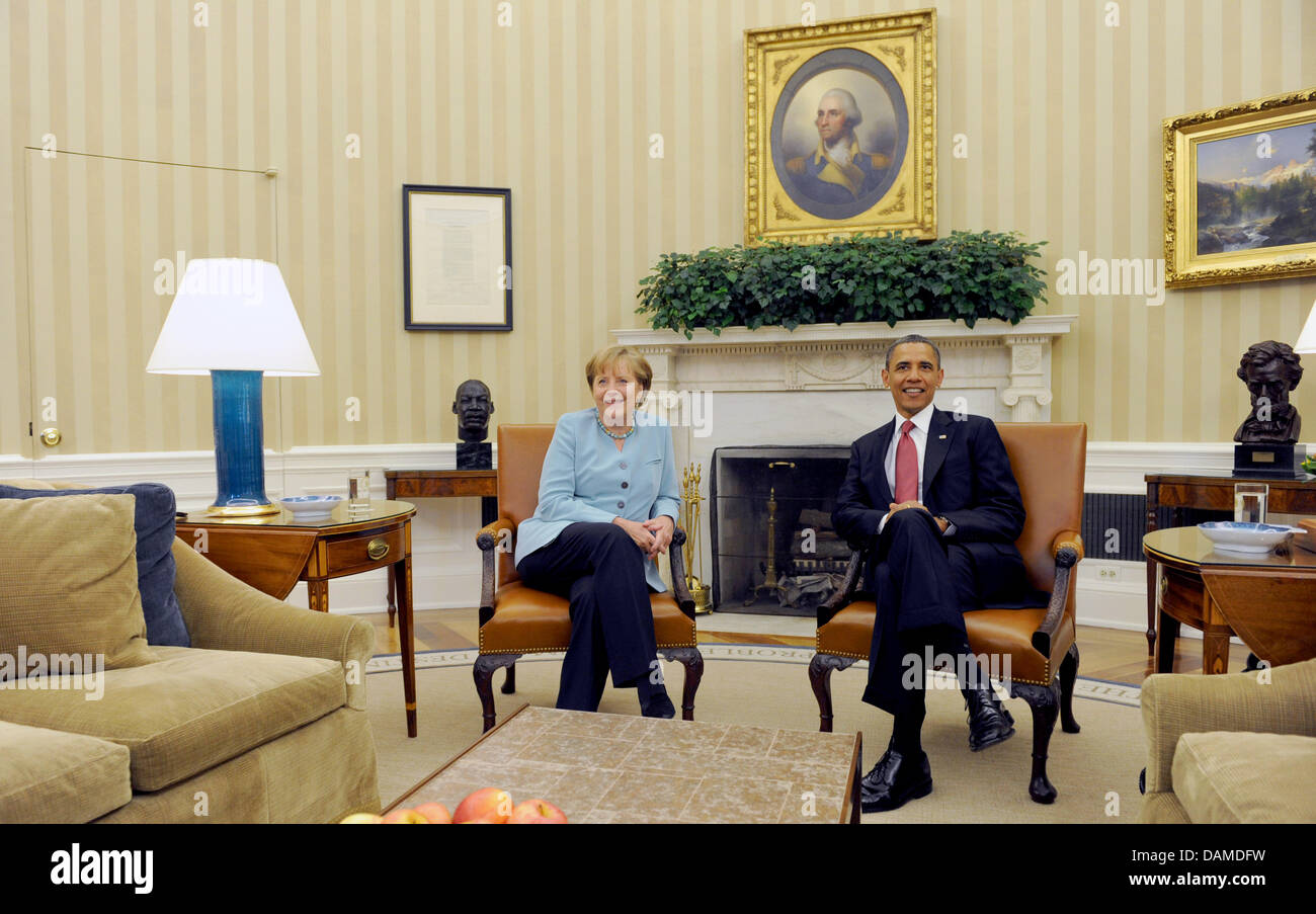German Chancellor Angela Merkel and US President Barack Obama converse ...