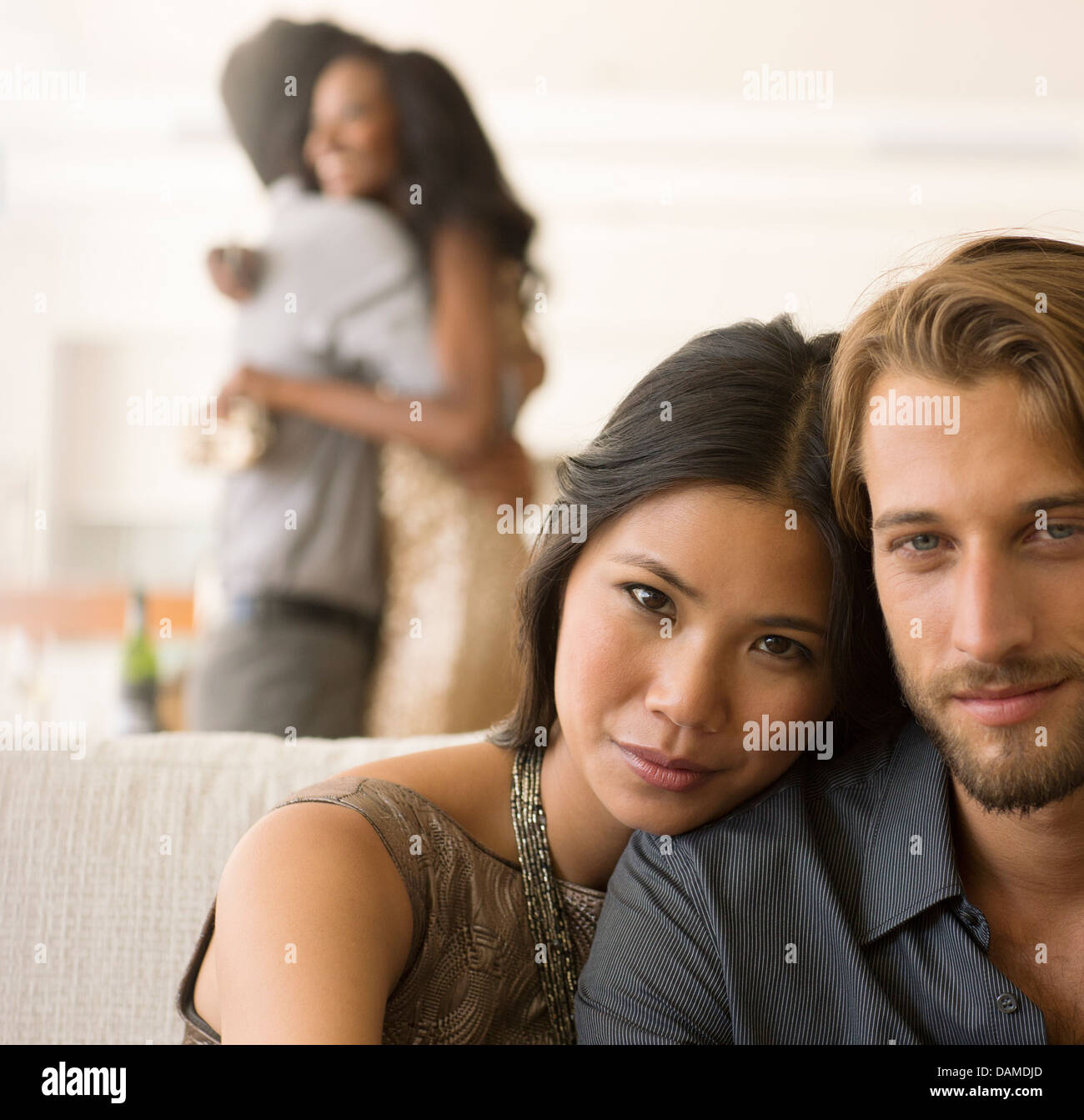 Four people hugging hi-res stock photography and images - Alamy
