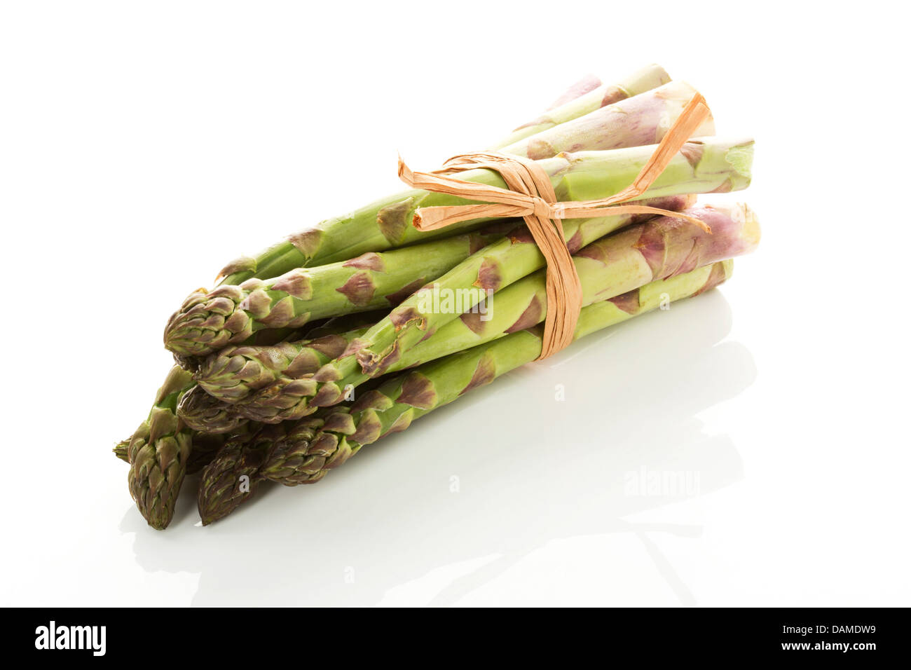 Bundle of green asparagus on white background, close up Stock Photo - Alamy