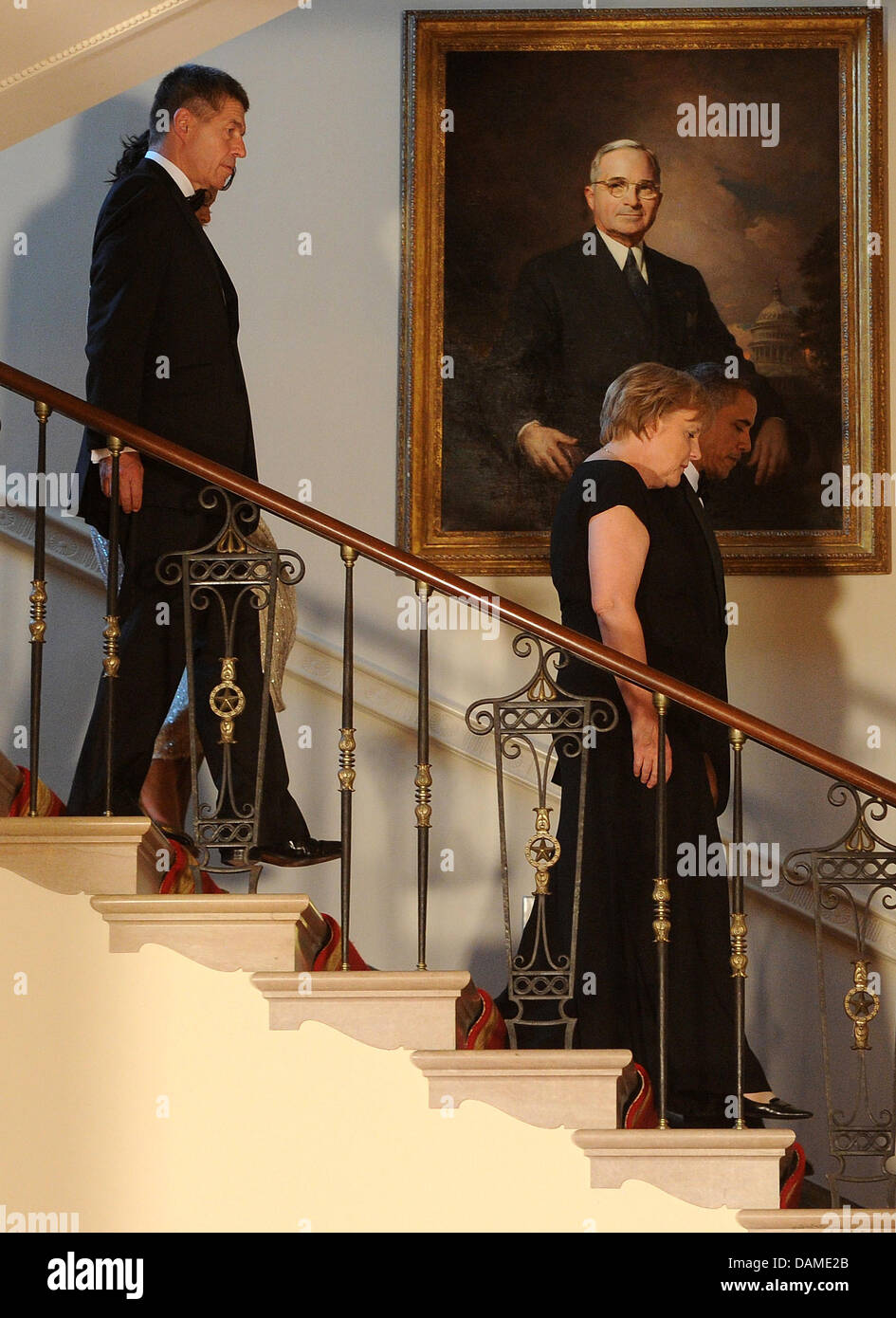 German Chancellor Angela Merkel and her husband Joachim Sauer arrive ...