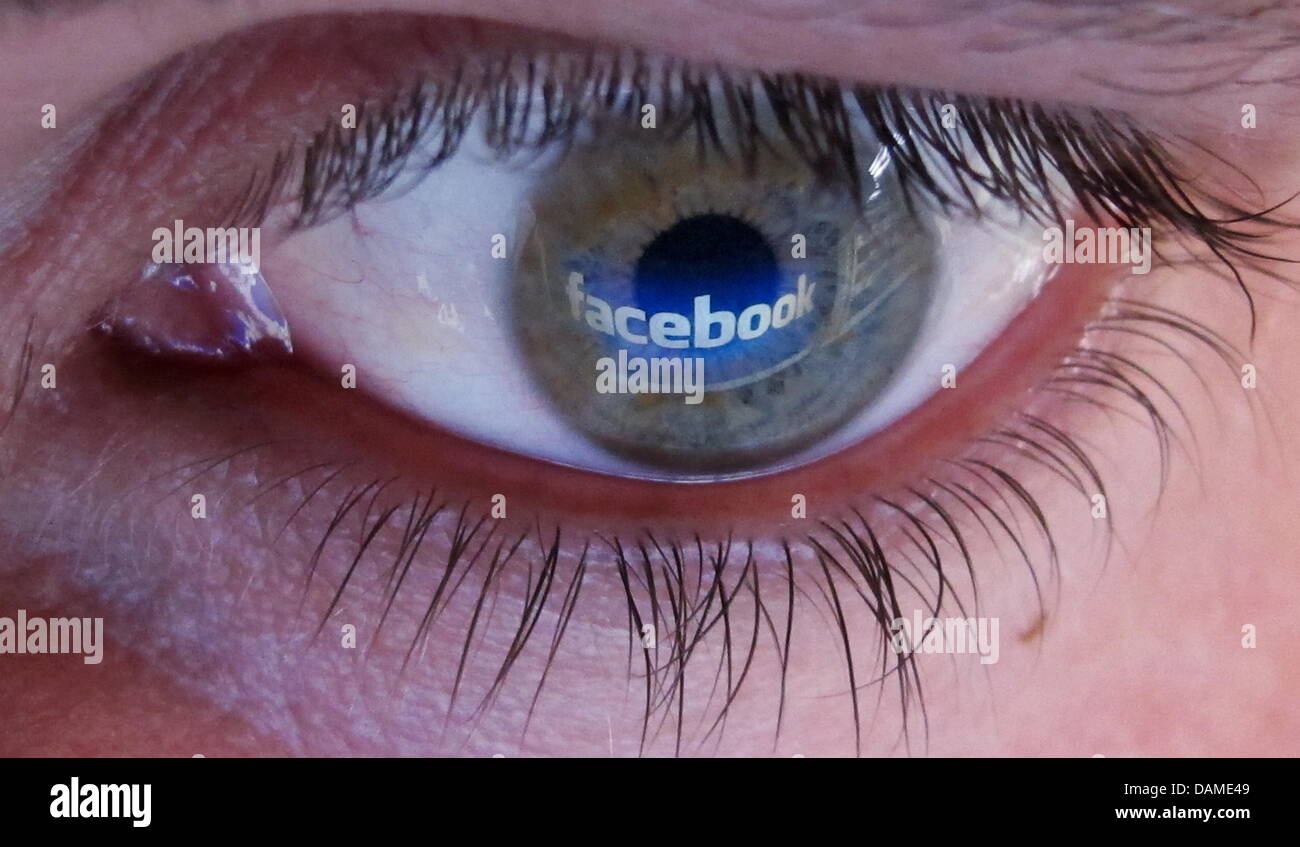 The facebook logo is reflected in an eye in Hanover, Germany, 8 June ...