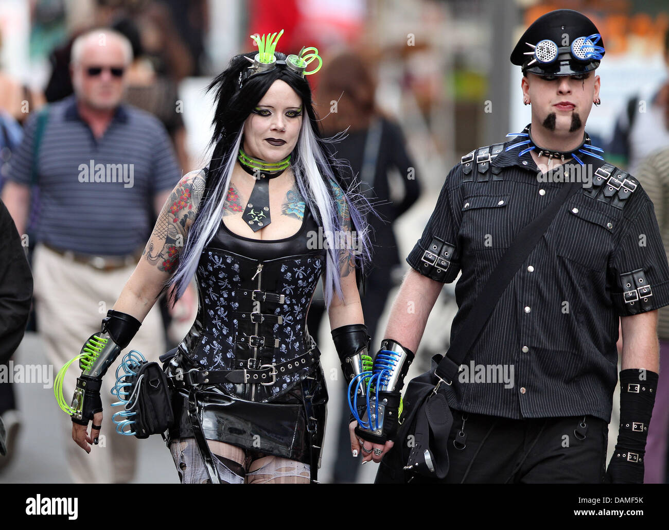 Two visitors to the Wave Gotik Treffen (Wave Gothik Meeting) walk ...