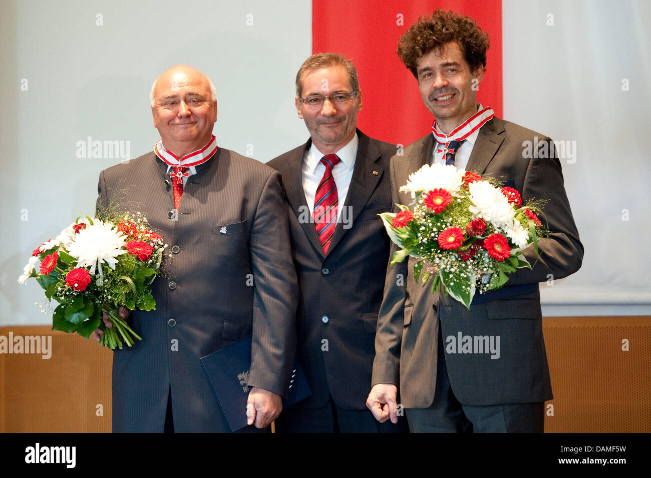 Brandenburg's Premier Matthias Platzeck (C) bestows the Order of Merit ...