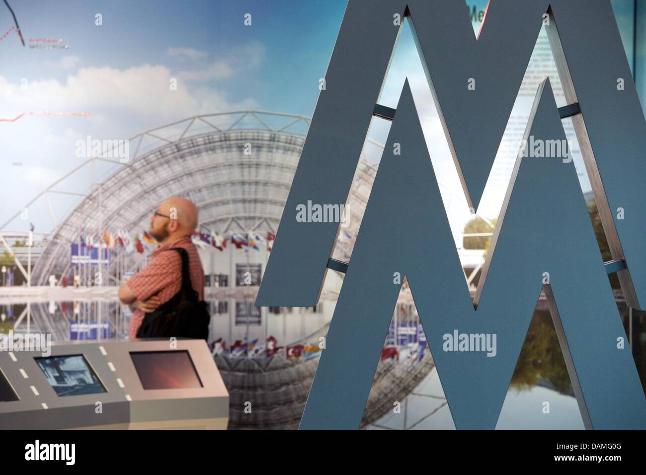 A visitor walks throught section 'Messestadt' (lit. trade fair town) as ...