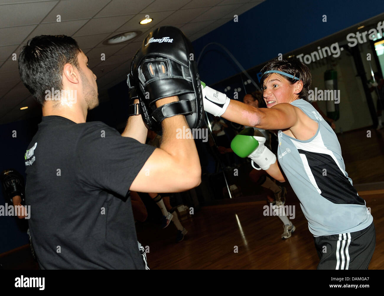 Ariane Hingst (R) of the German national soccer team boxes with a ...