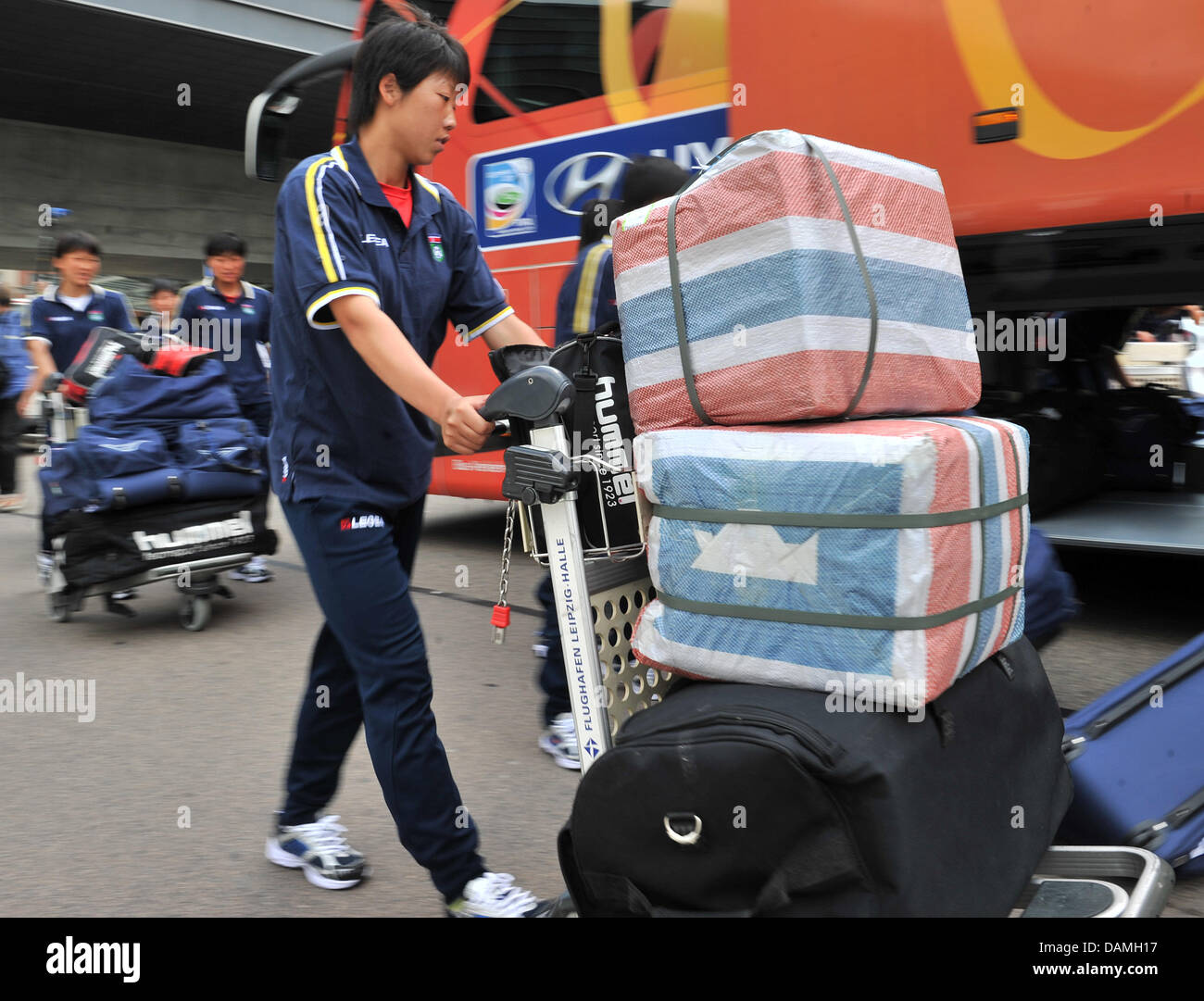 North Korea's women's national soccer team boards the team bus after ...