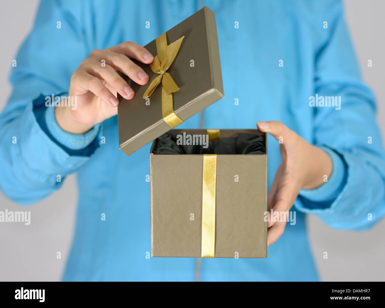 opening a gift Stock Photo - Alamy