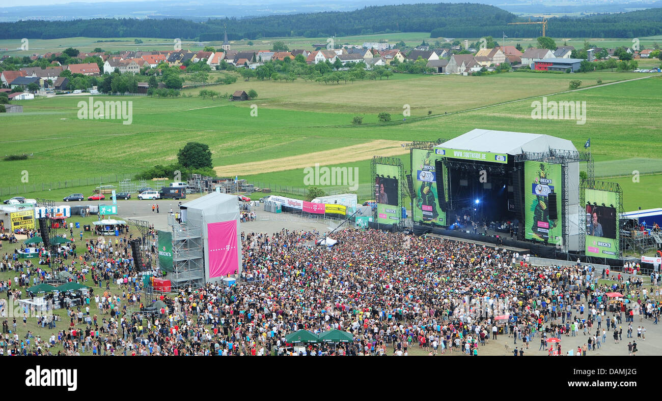 A large audience stands in front of the 'Green Stage' at the Southside ...