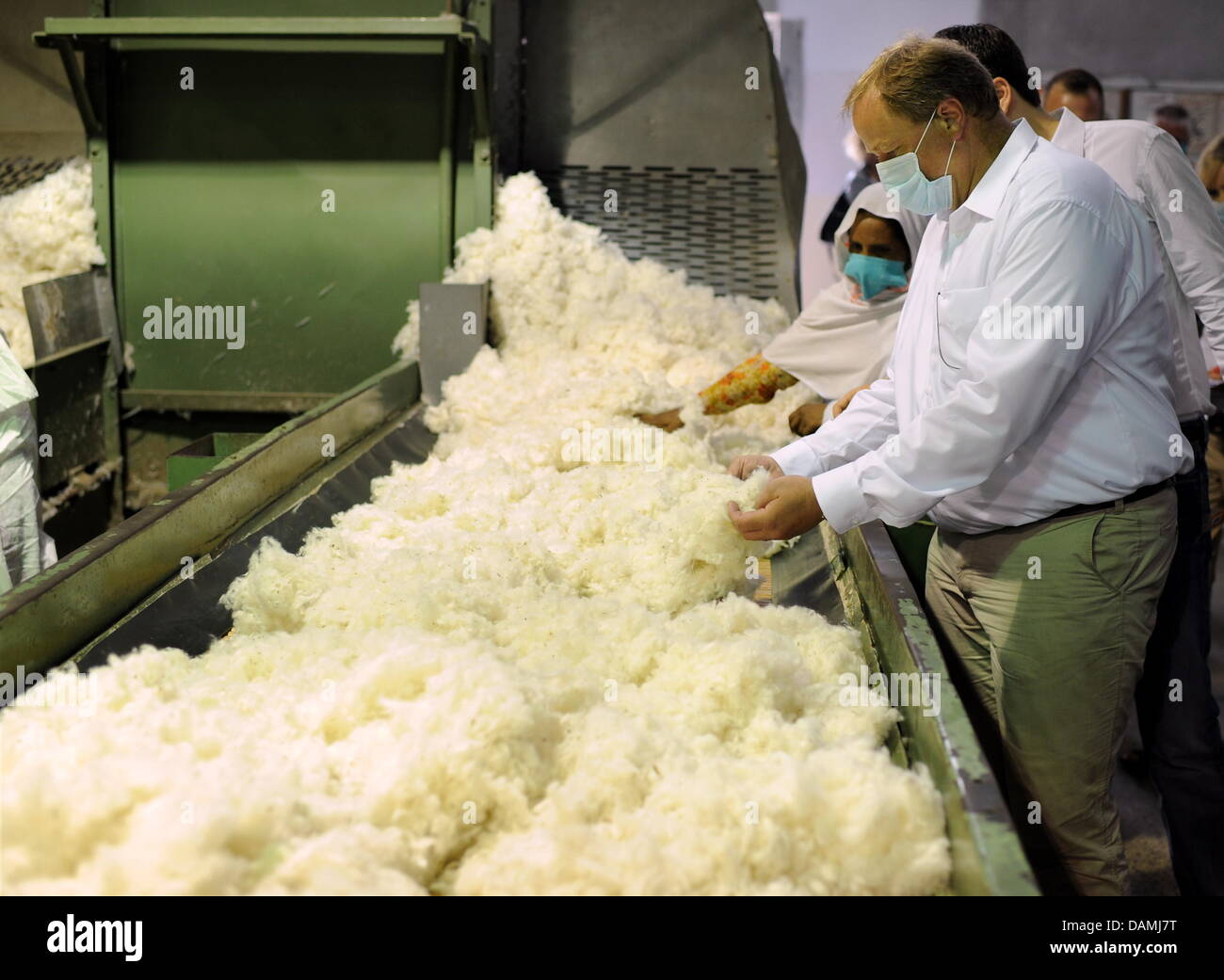 Development aid minister Dirk Niebel (FRONT) visits the textile factory ...