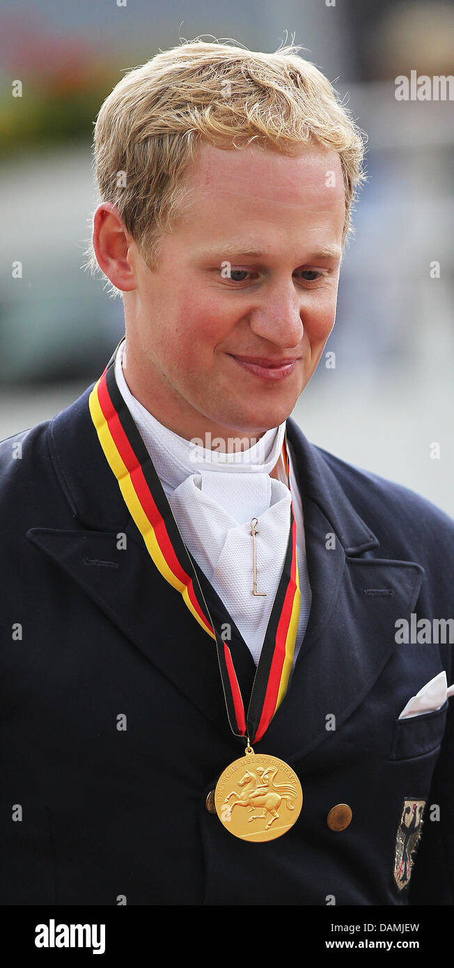 Rider Matthias Rath cheers about his golden medail at the German ...