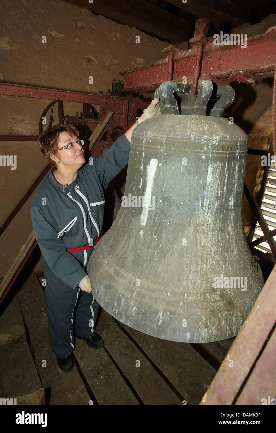 Bells' specialist Birgit Mueller checks the bell at the steeple of the ...